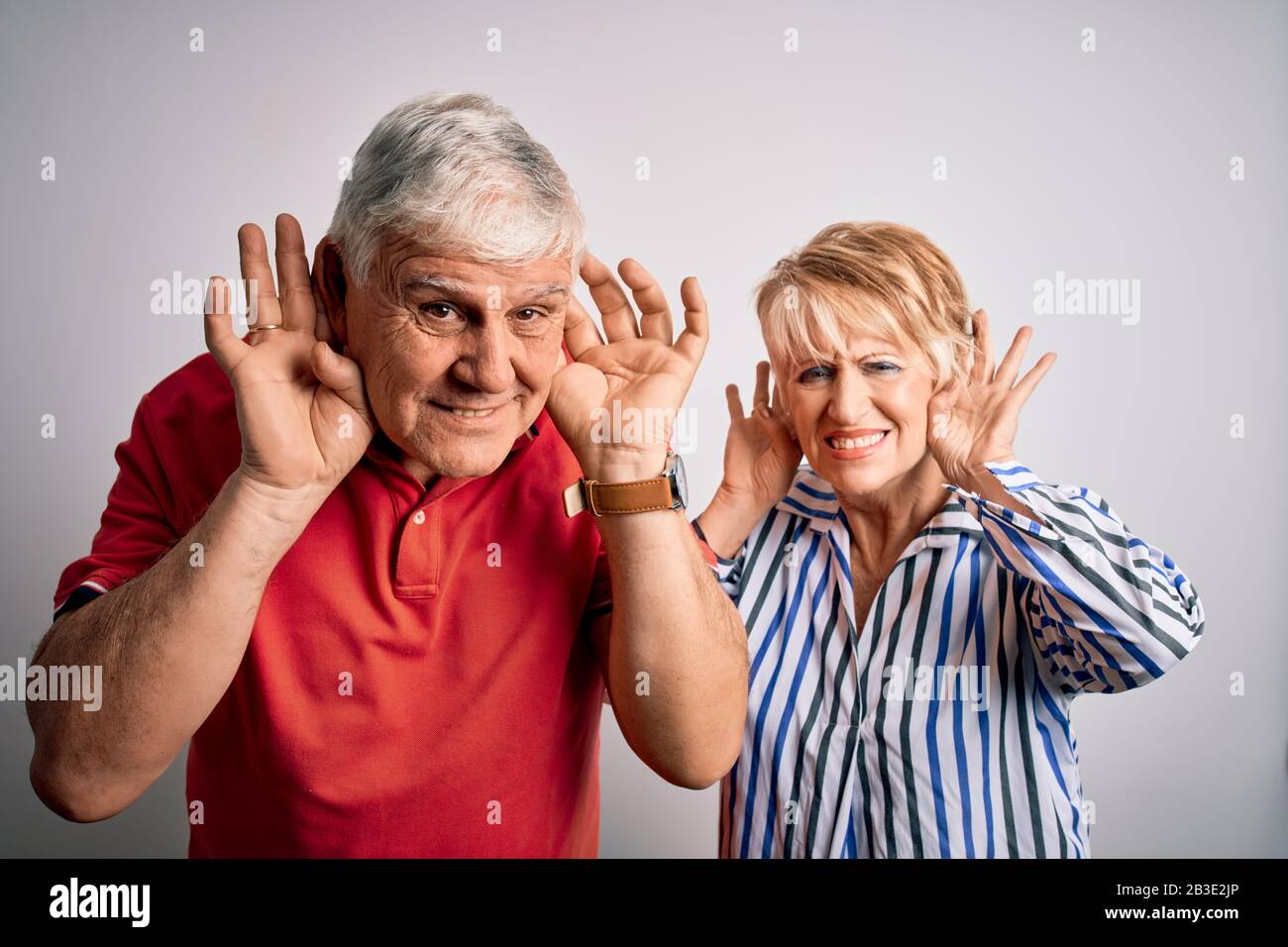 Senior beautiful couple standing together over isolated white ...