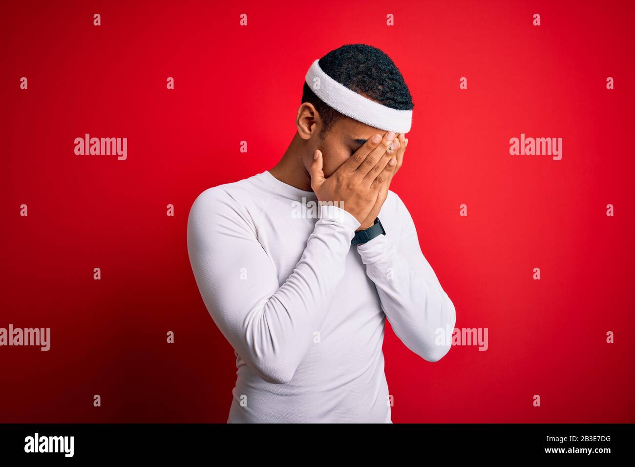 Young handsome african american sportsman wearing sportswear over red ...