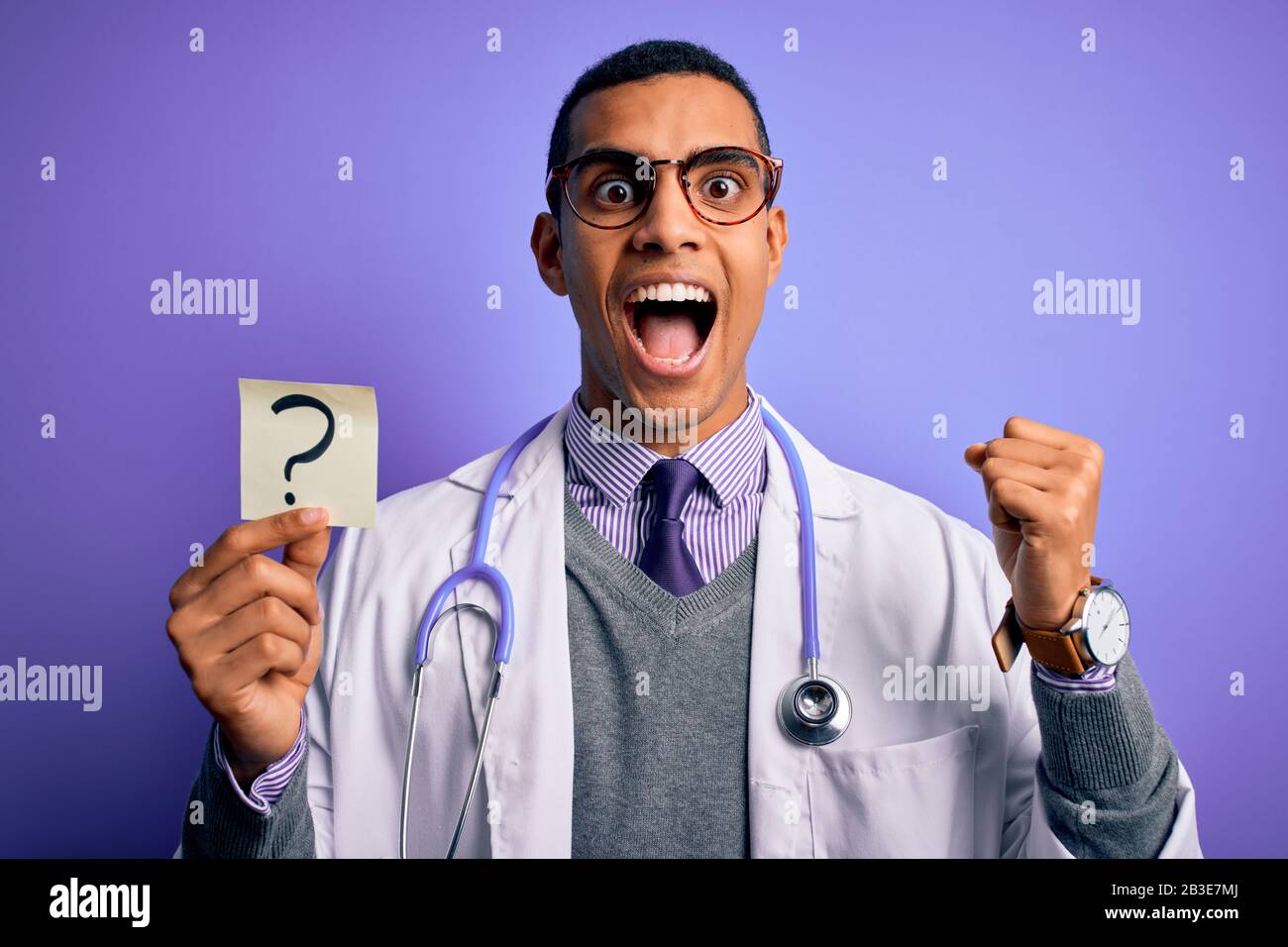 Handsome african american doctor man wearing stethoscope holding ...