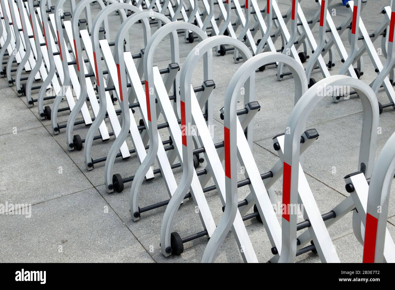 Sliding and folding barrier with wheels Stock Photo - Alamy