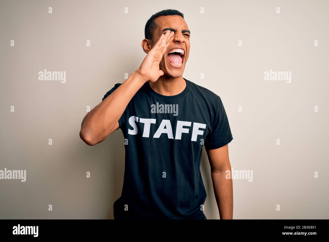 Young handsome african american worker man wearing staff uniform over ...