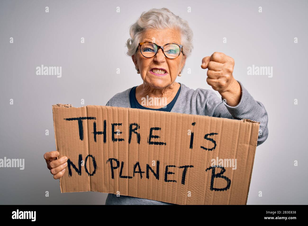 Senior beautiful grey-haired woman asking for environment holding ...