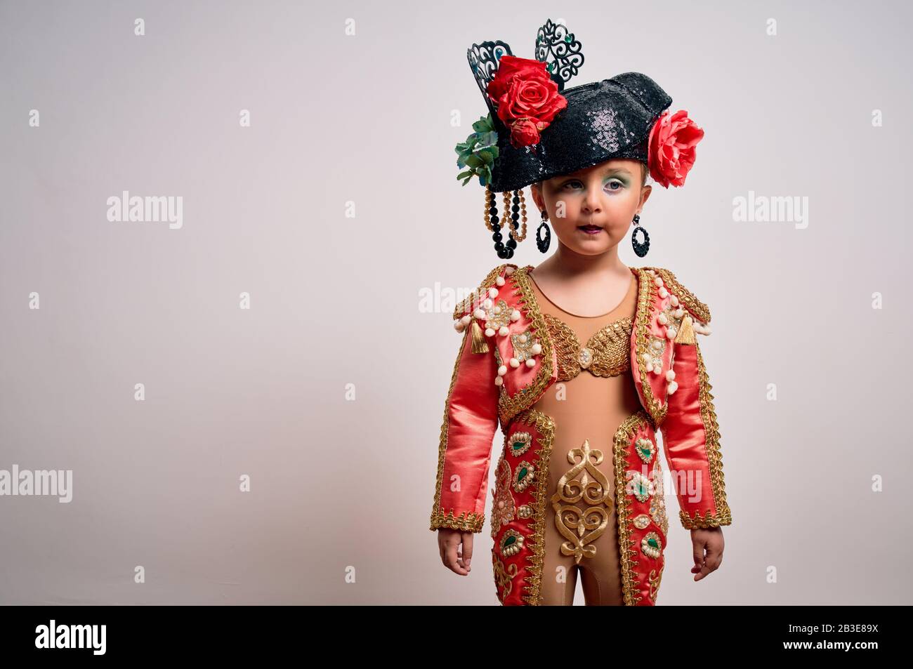 Young little caucasian kid girl wearing bullfighter traditional folkore ...
