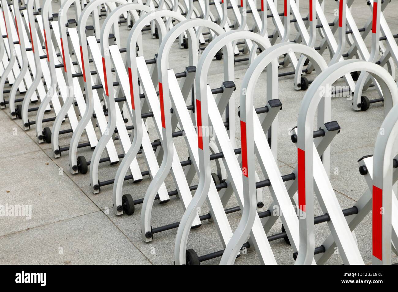 Sliding and folding barrier with wheels Stock Photo - Alamy