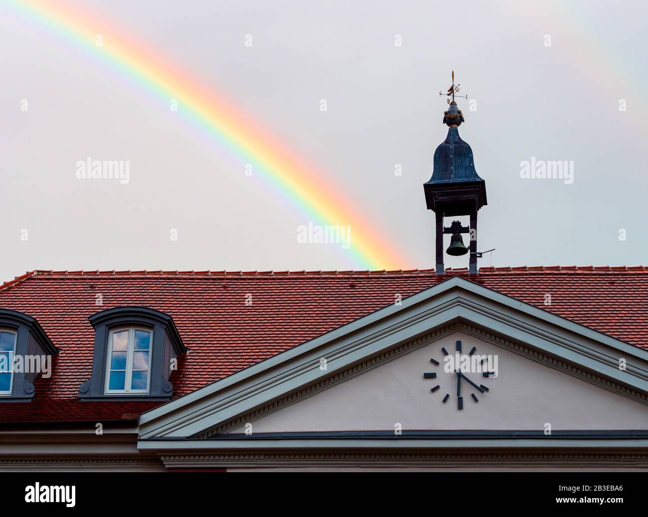 Rainbow after the rain over the lovely villages of Alsace, France Stock ...