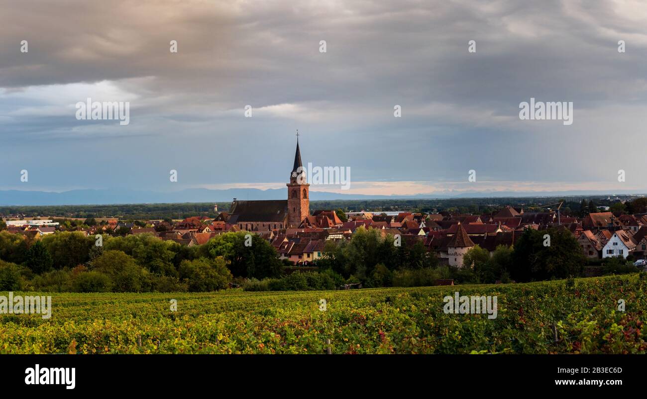 Rainbow after the rain over the lovely villages of Alsace, France Stock ...