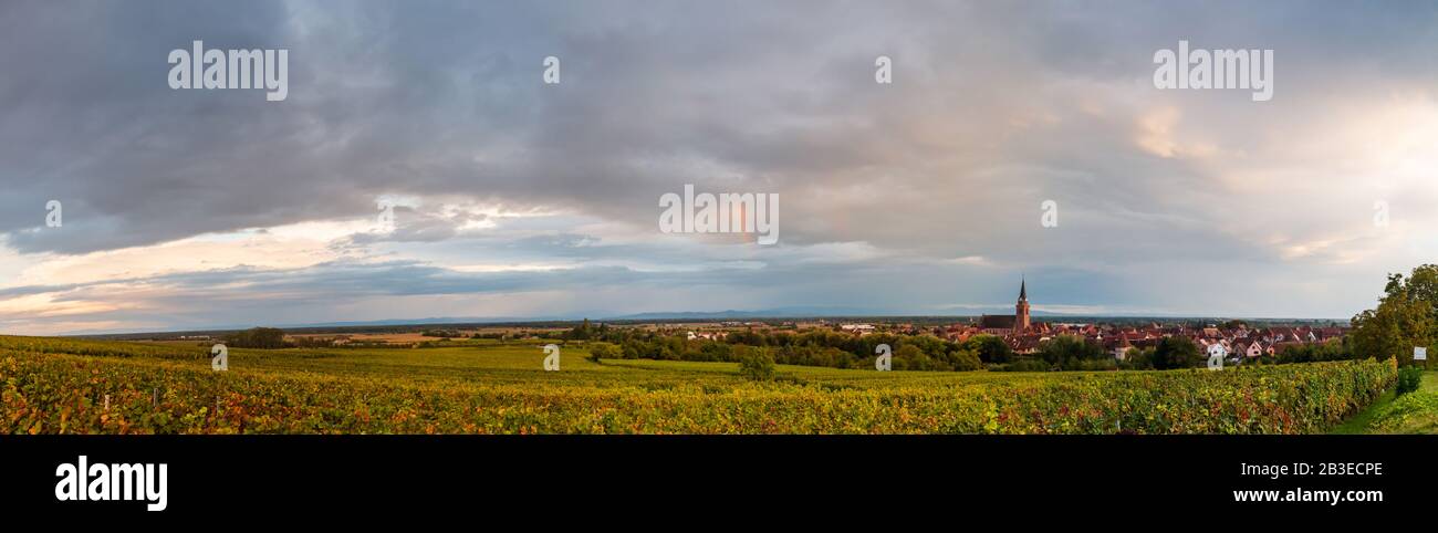 Rainbow after the rain over the lovely villages of Alsace, France Stock ...