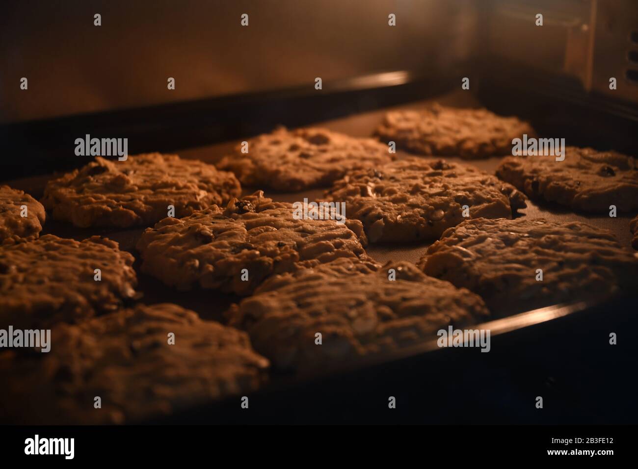Baking cookies in bakery oven with high temperature Stock Photo - Alamy