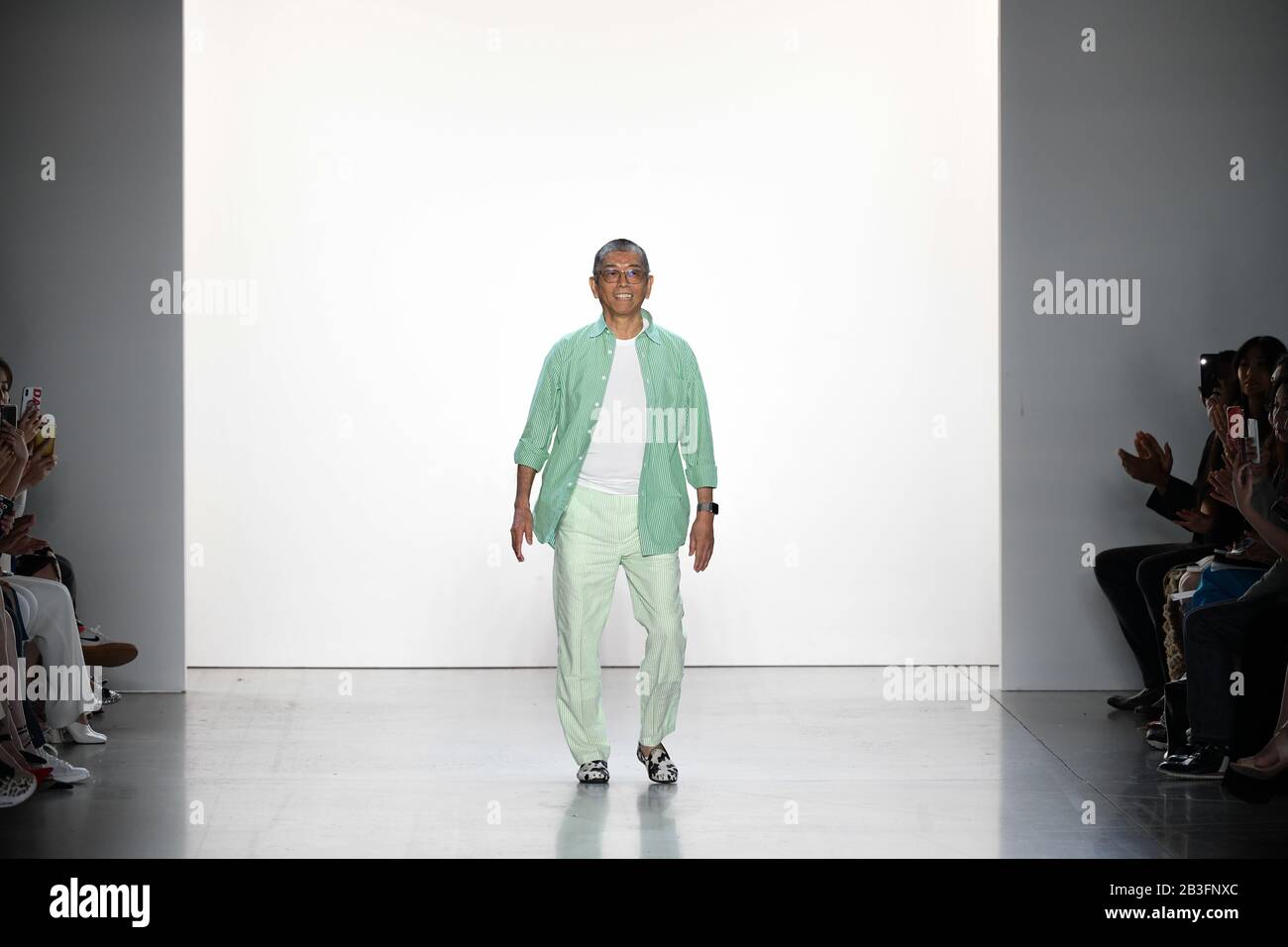 NEW YORK, NEW YORK - SEPTEMBER 05: Designer Tadashi Shoji greets the ...