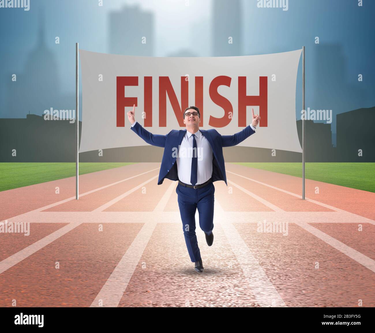 The businessman on the finishing line in competition concept Stock ...