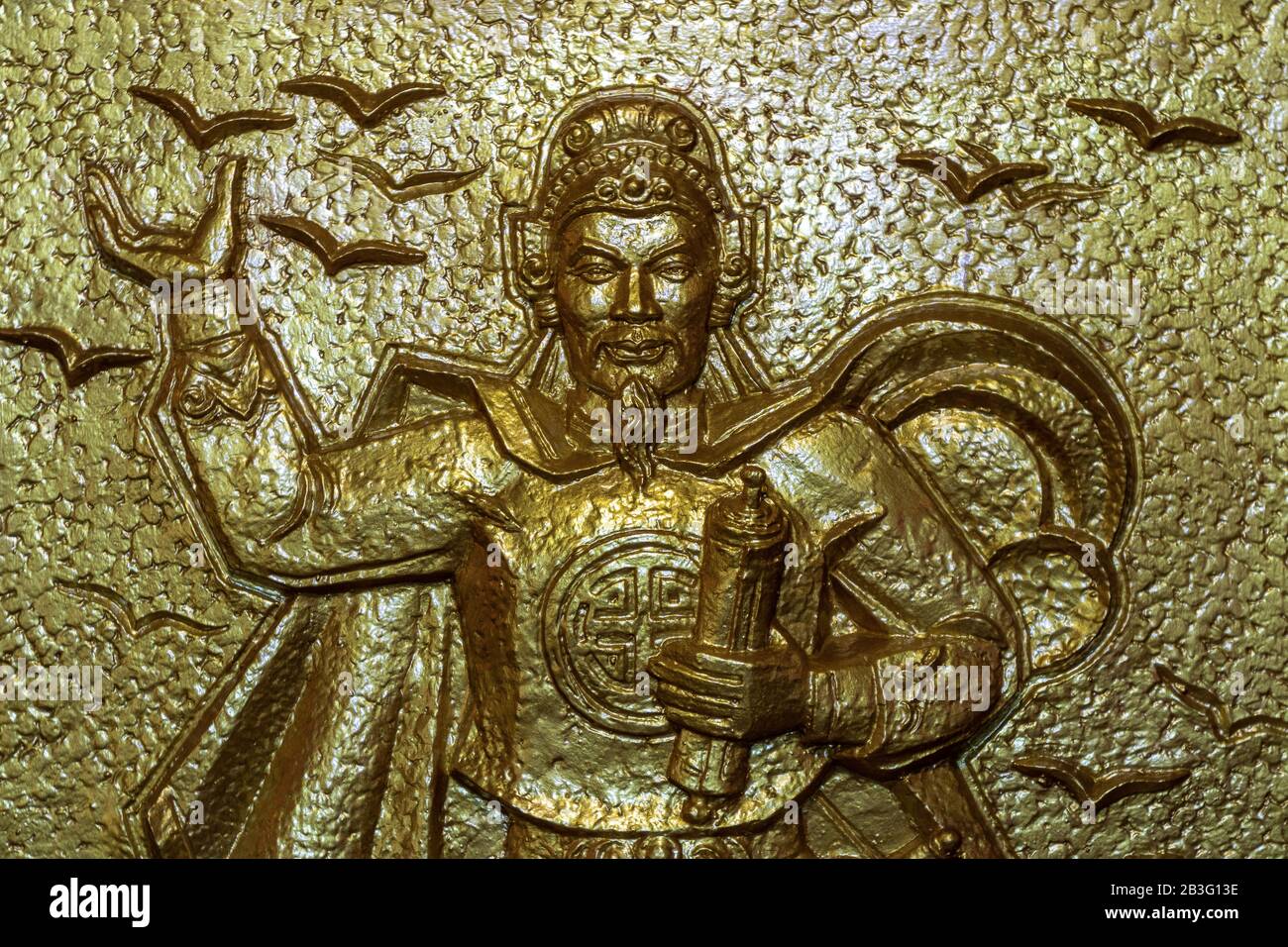 statue in temple god of asia yellow and gold colors Stock Photo - Alamy