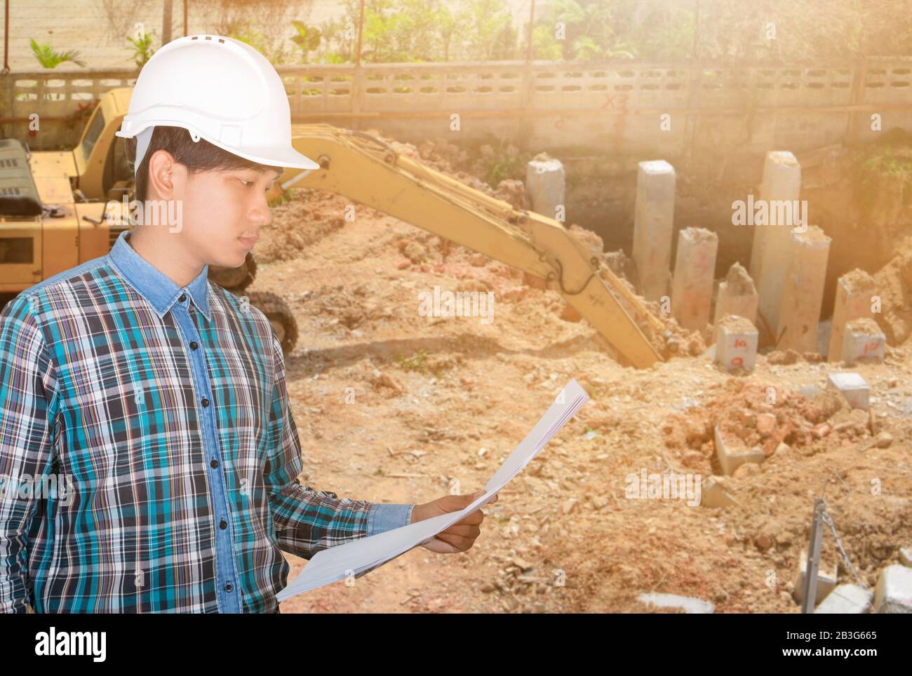 Engineer open hold blueprints in Construction site concept Blurred ...