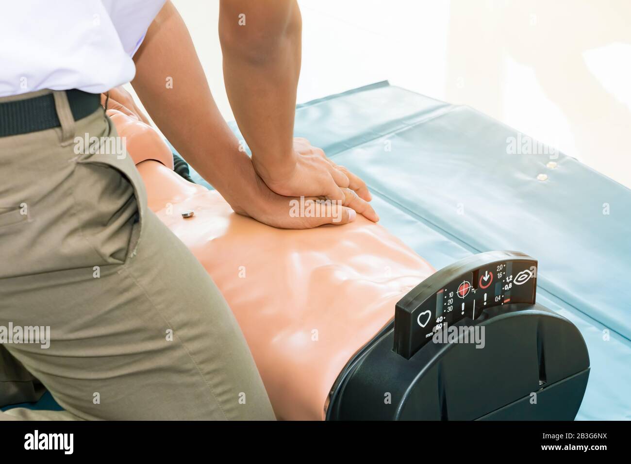 CPR aid dummy medical training with hand press Heart on doll emergency ...