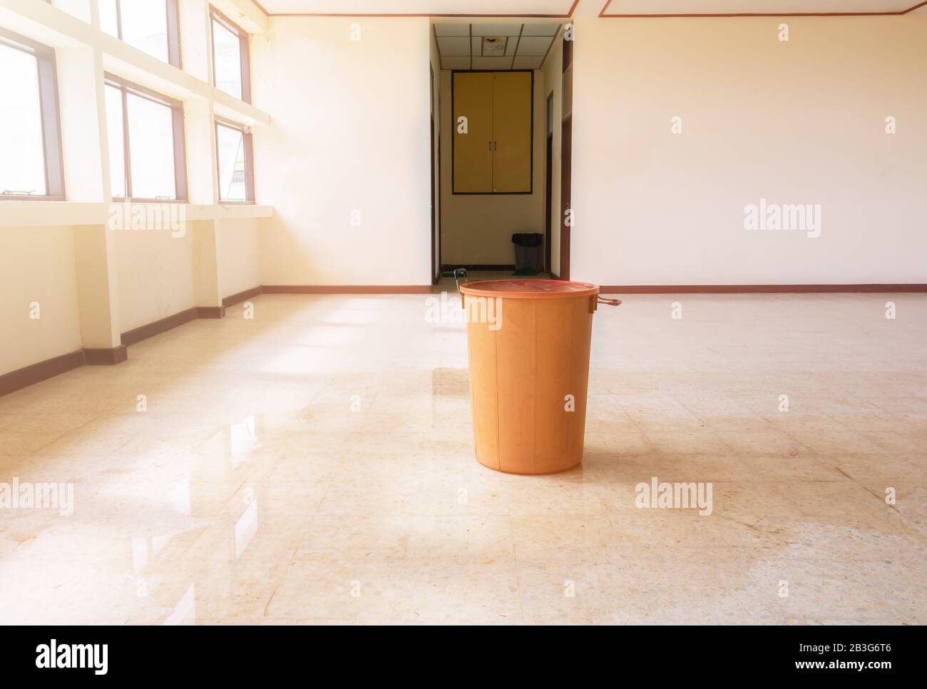 water leak drop interior office building in red bucket from Ceiling and ...