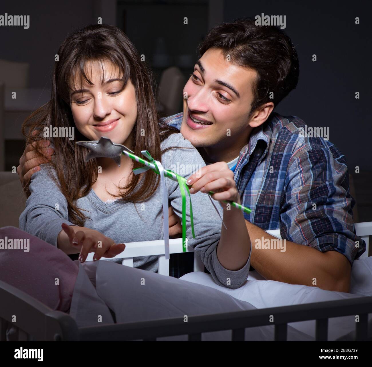 Young parents sleepless with newborn baby at night Stock Photo - Alamy