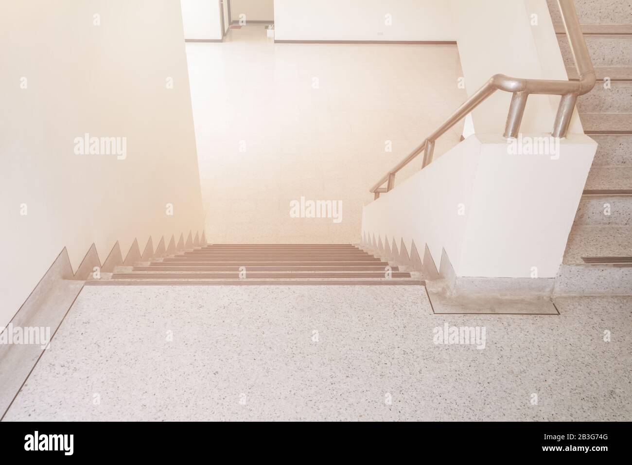 stairs walkway down terrazzo flooring in interior building Stock Photo ...
