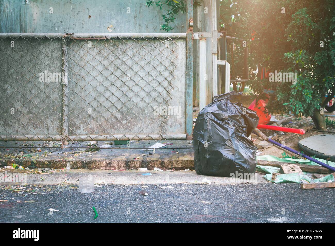 plastic trash bag. Pile black garbage roadside Stock Photo - Alamy