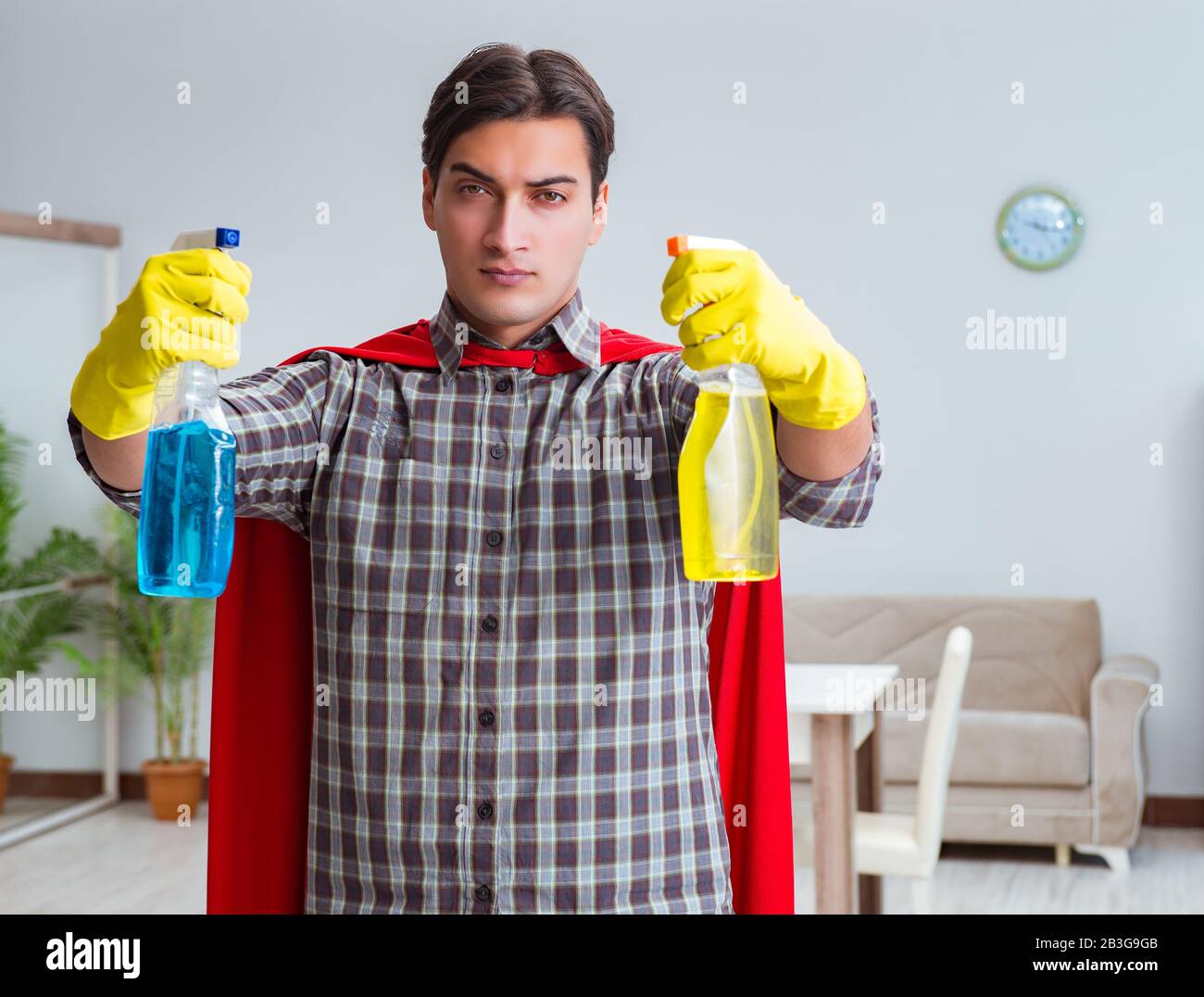 The super hero cleaner working at home Stock Photo - Alamy