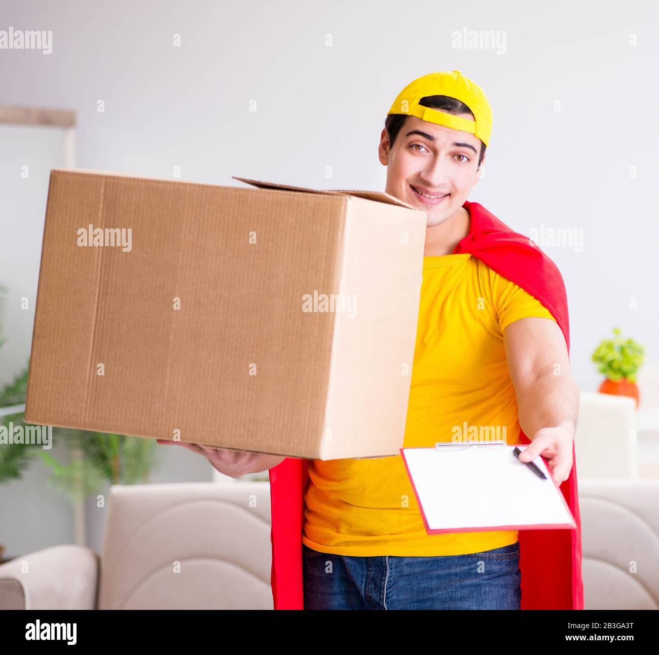 The superhero delivery guy with box Stock Photo - Alamy