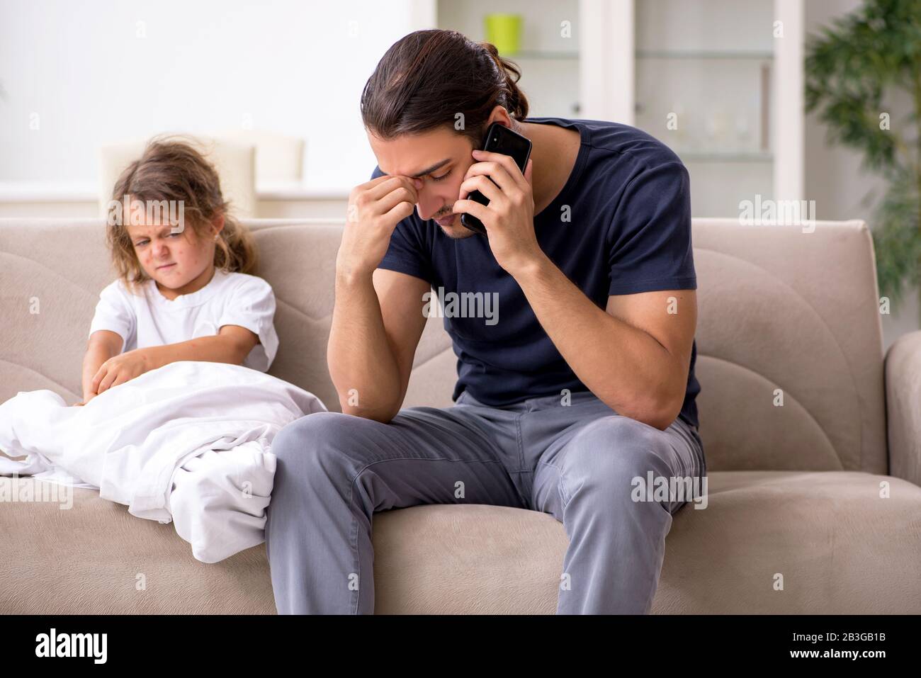 The father taking care of his ill daughter Stock Photo - Alamy