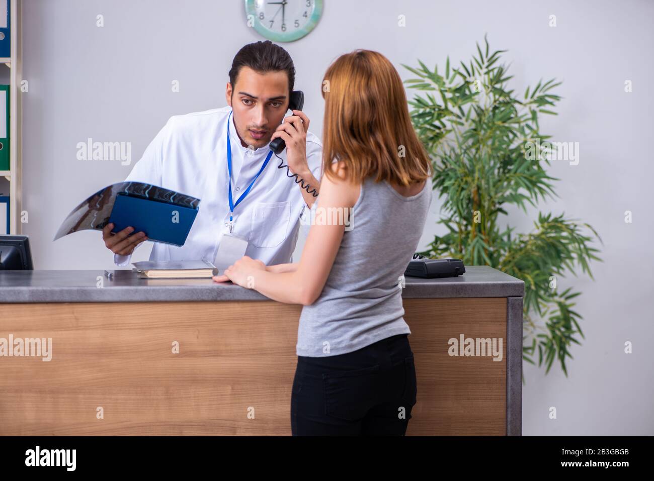 The young patient at the reception in the hospital Stock Photo - Alamy