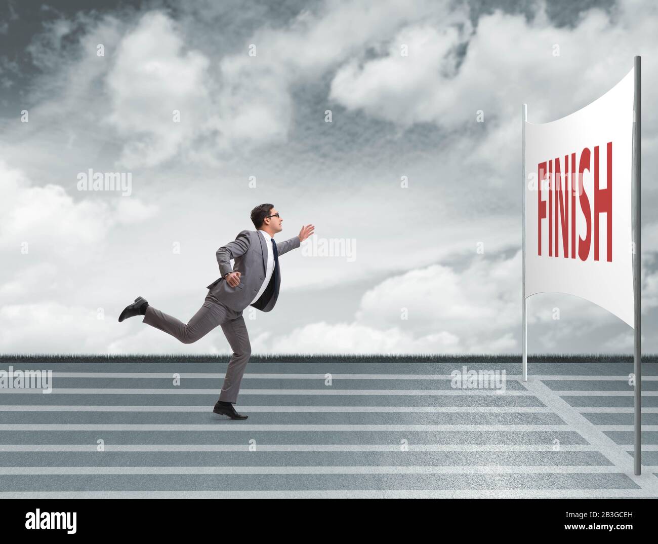 The businessman on the finishing line in competition concept Stock ...