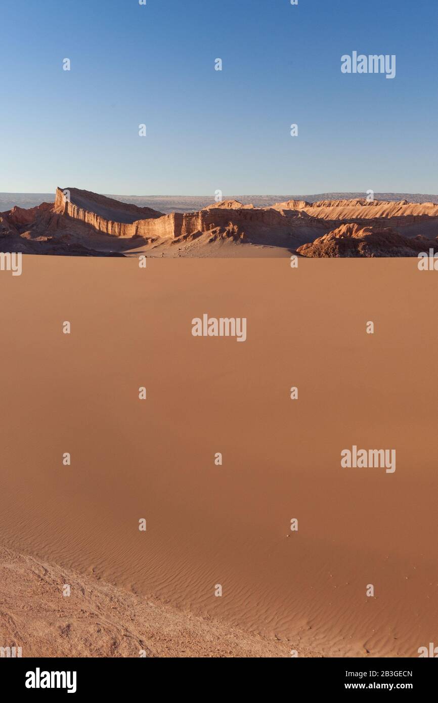 The setting sun over the Atacama Desert, Chile, highlights the hues and ...
