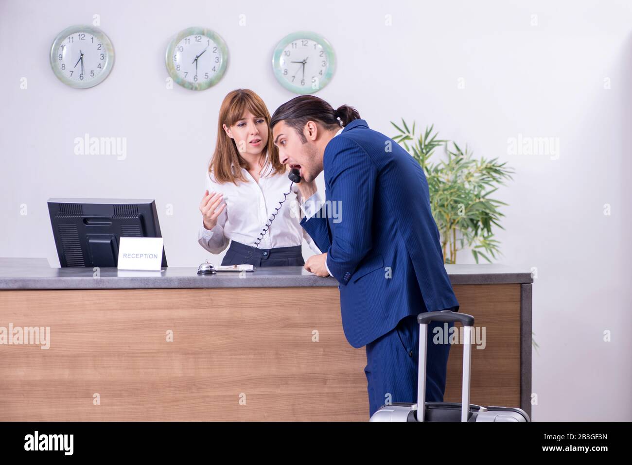 Woman hotel reception angry hi-res stock photography and images - Alamy