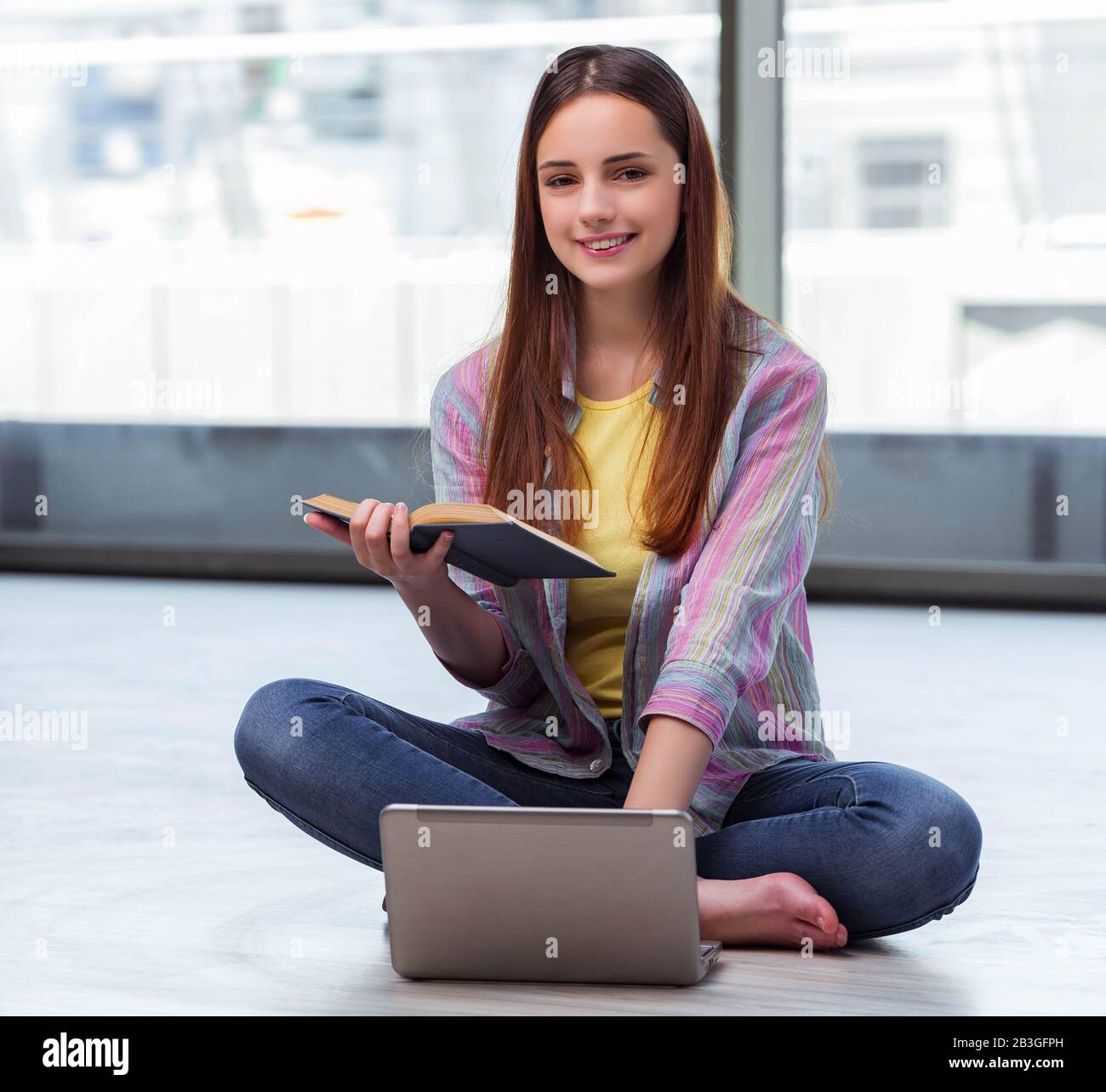 The young girl surfing internet on laptop Stock Photo - Alamy