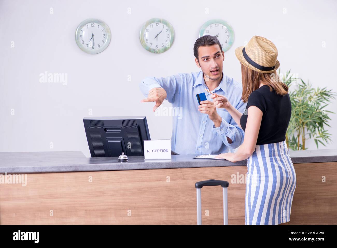 The young woman at hotel reception Stock Photo - Alamy