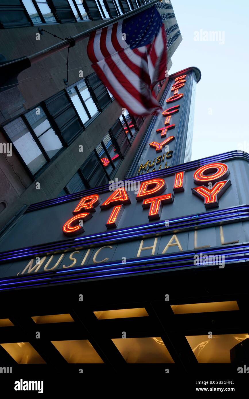 Radio City Music Hall neon sign with a US flag. Rockefeller Center ...