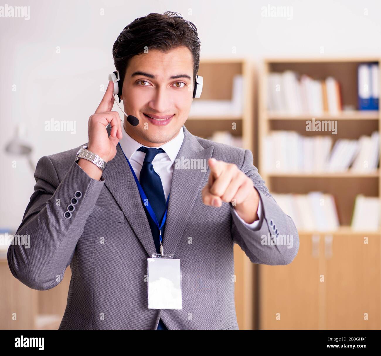The handsome customer service clerk with headset Stock Photo - Alamy