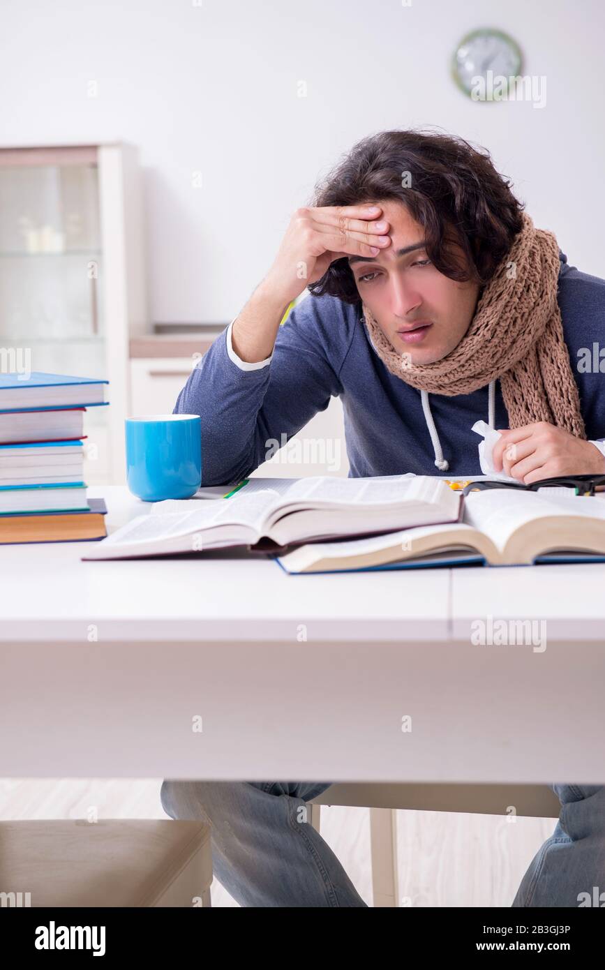 The sick male student suffering at home Stock Photo - Alamy