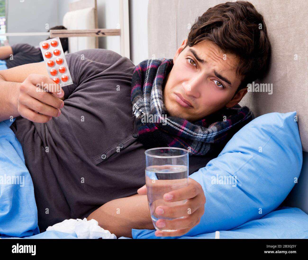 The sick ill man in the bed taking medicines and drugs Stock Photo - Alamy