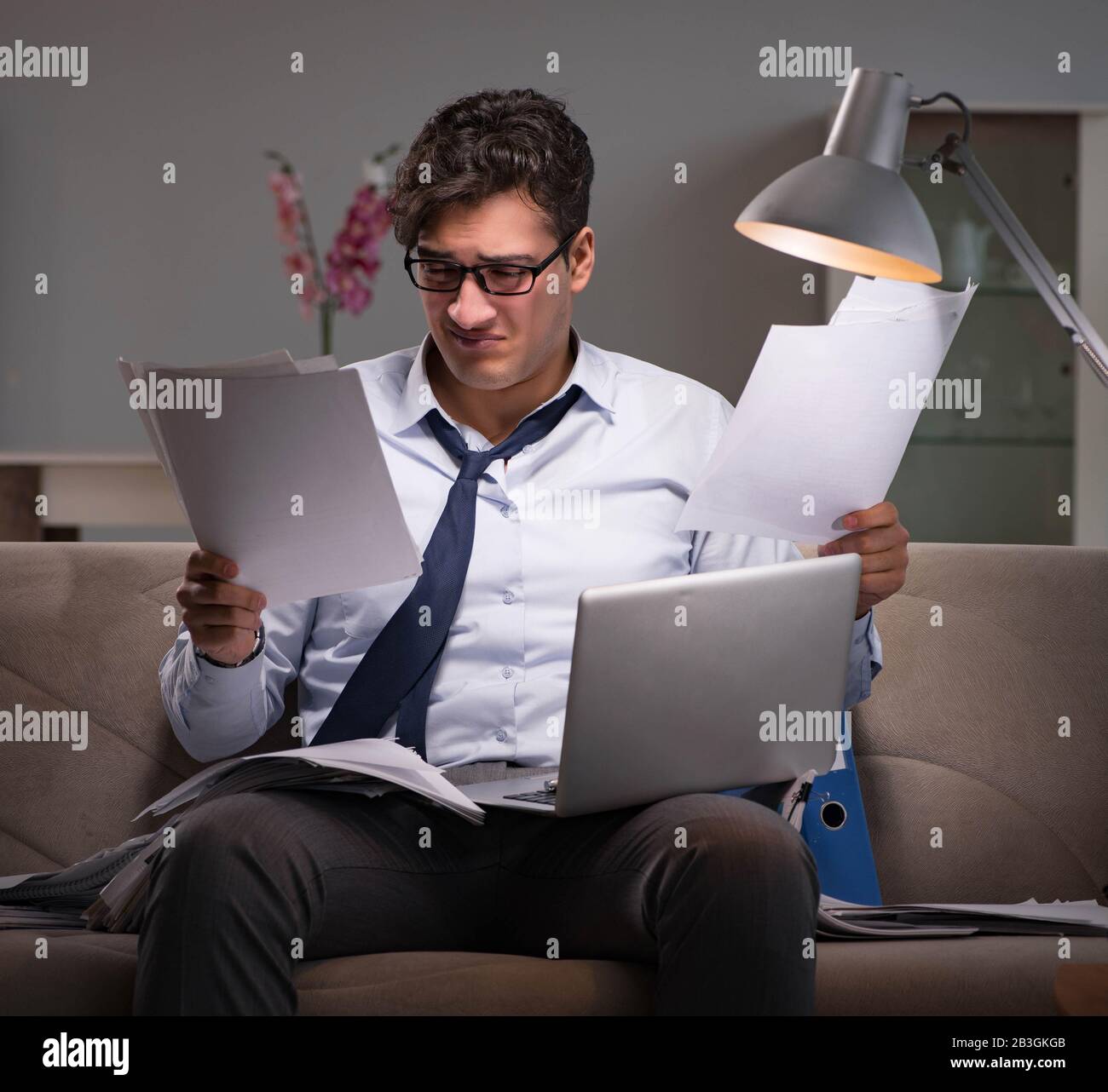 The businessman workaholic working late at home Stock Photo - Alamy