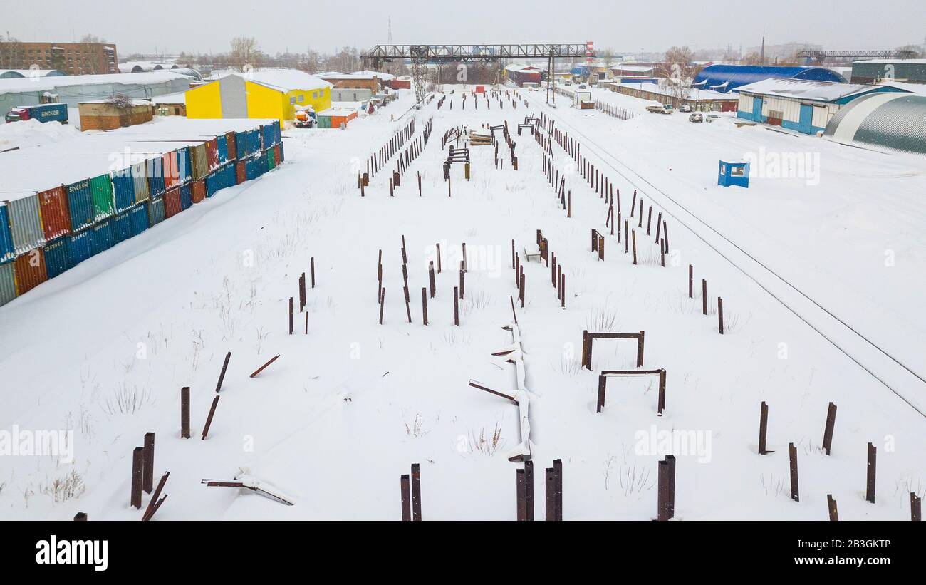 metal structures on the background of a construction site in snow ...