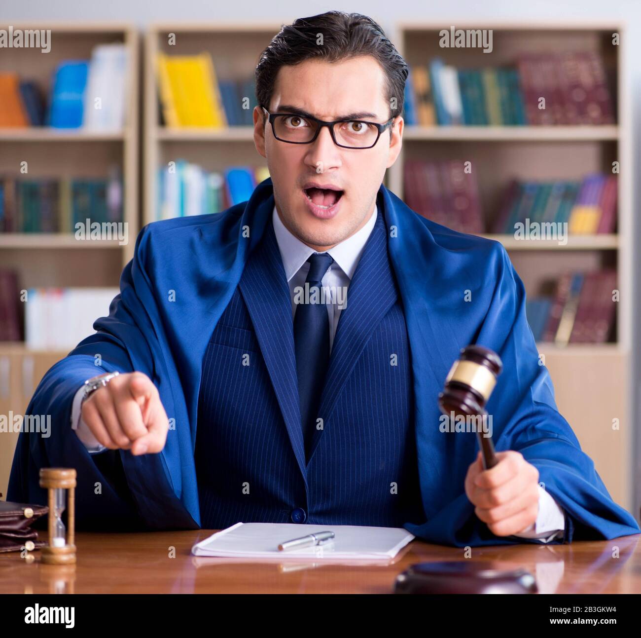 The handsome judge with gavel sitting in courtroom Stock Photo - Alamy