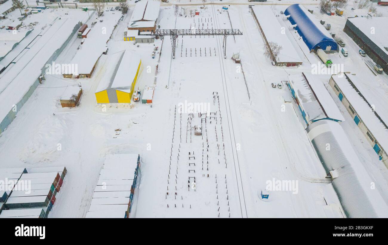 metal structures on the background of a construction site in snow ...