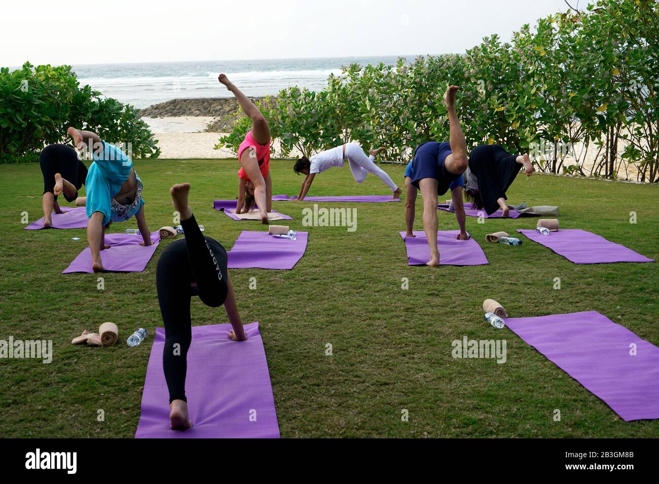 Morning yoga class by the beach at Ritz-Carlton Bali Hotel Resort.Nusa ...