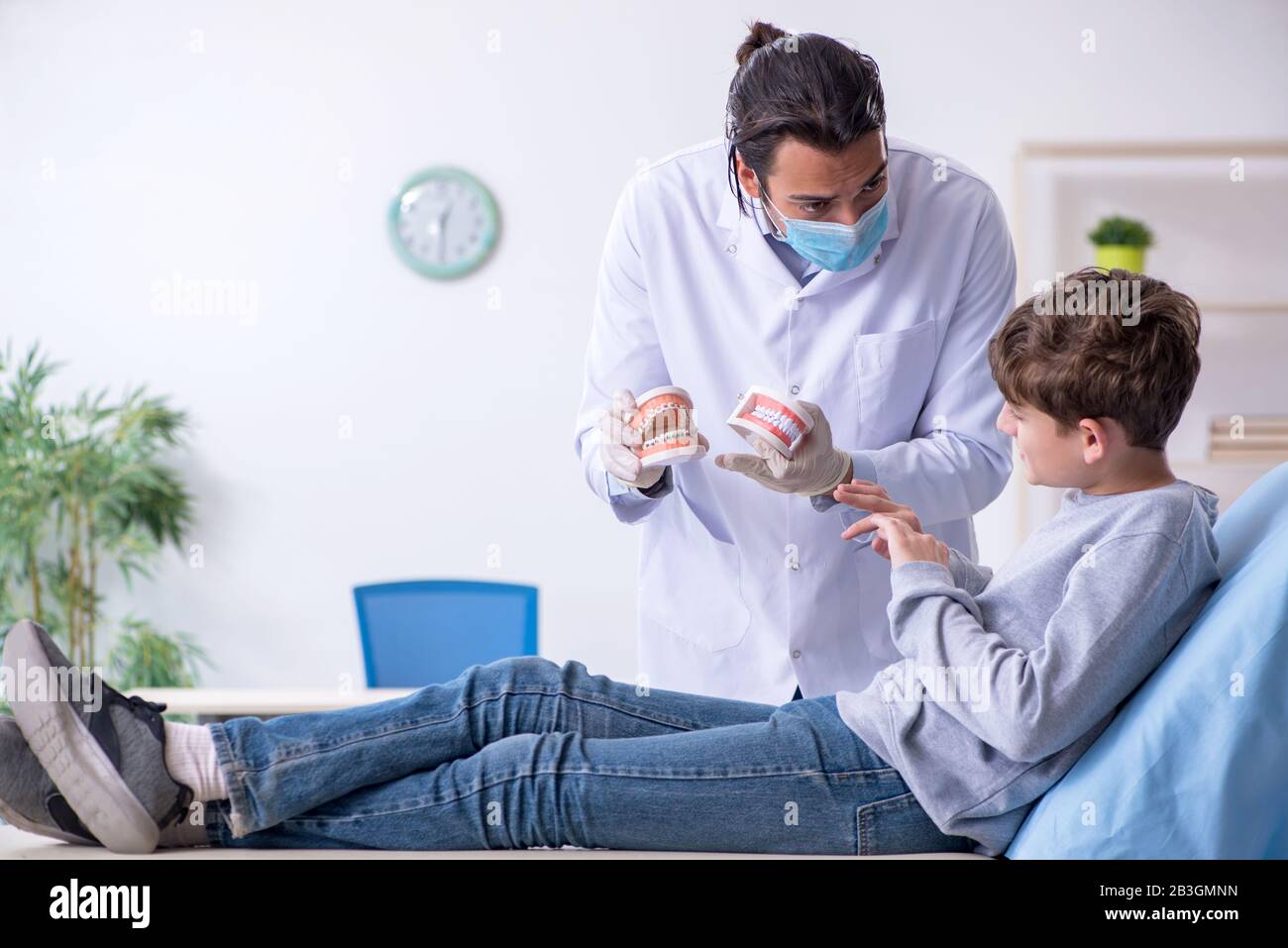 The young boy visiting doctor in hospital Stock Photo - Alamy