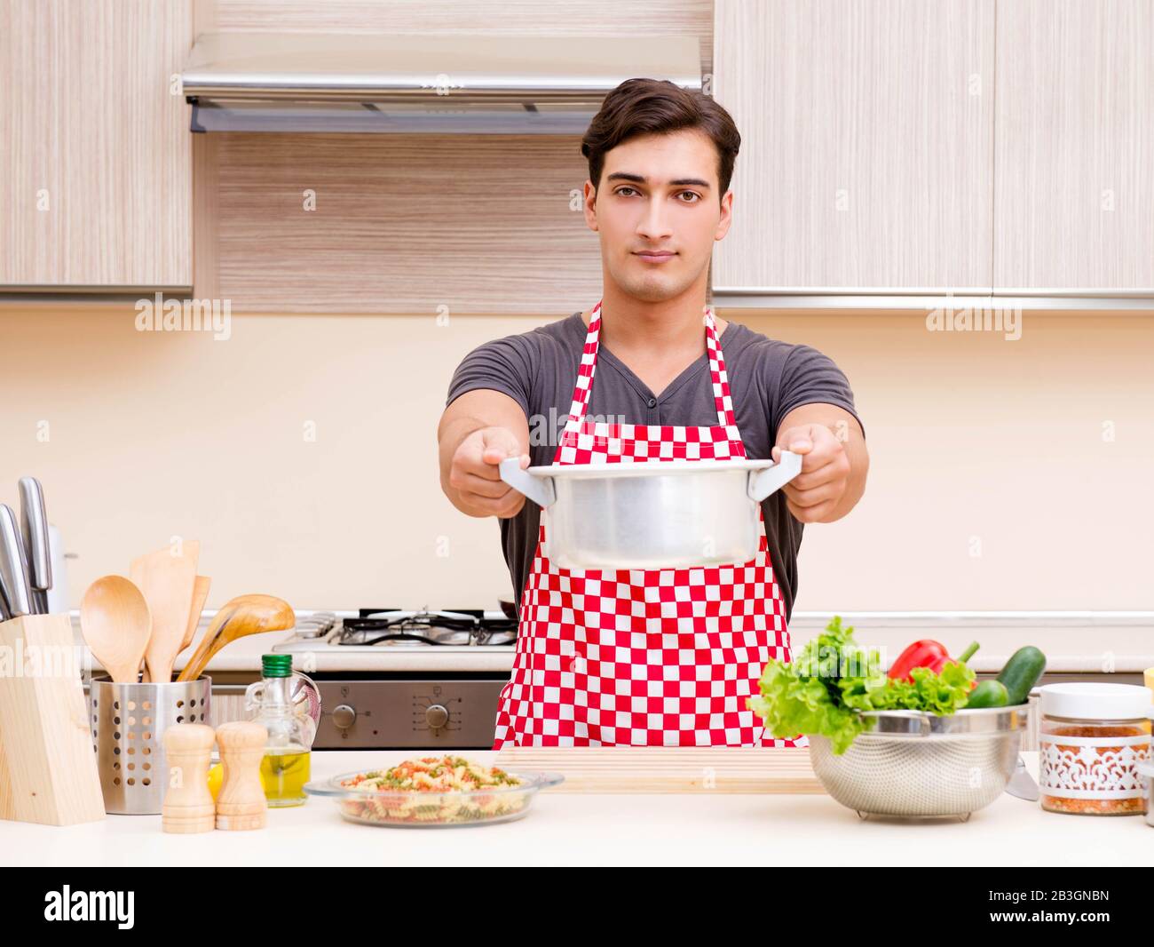 The man male cook preparing food in kitchen Stock Photo - Alamy
