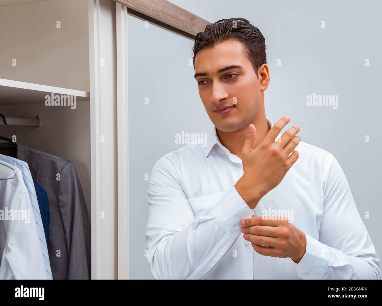 The businessman dressing up for work Stock Photo - Alamy