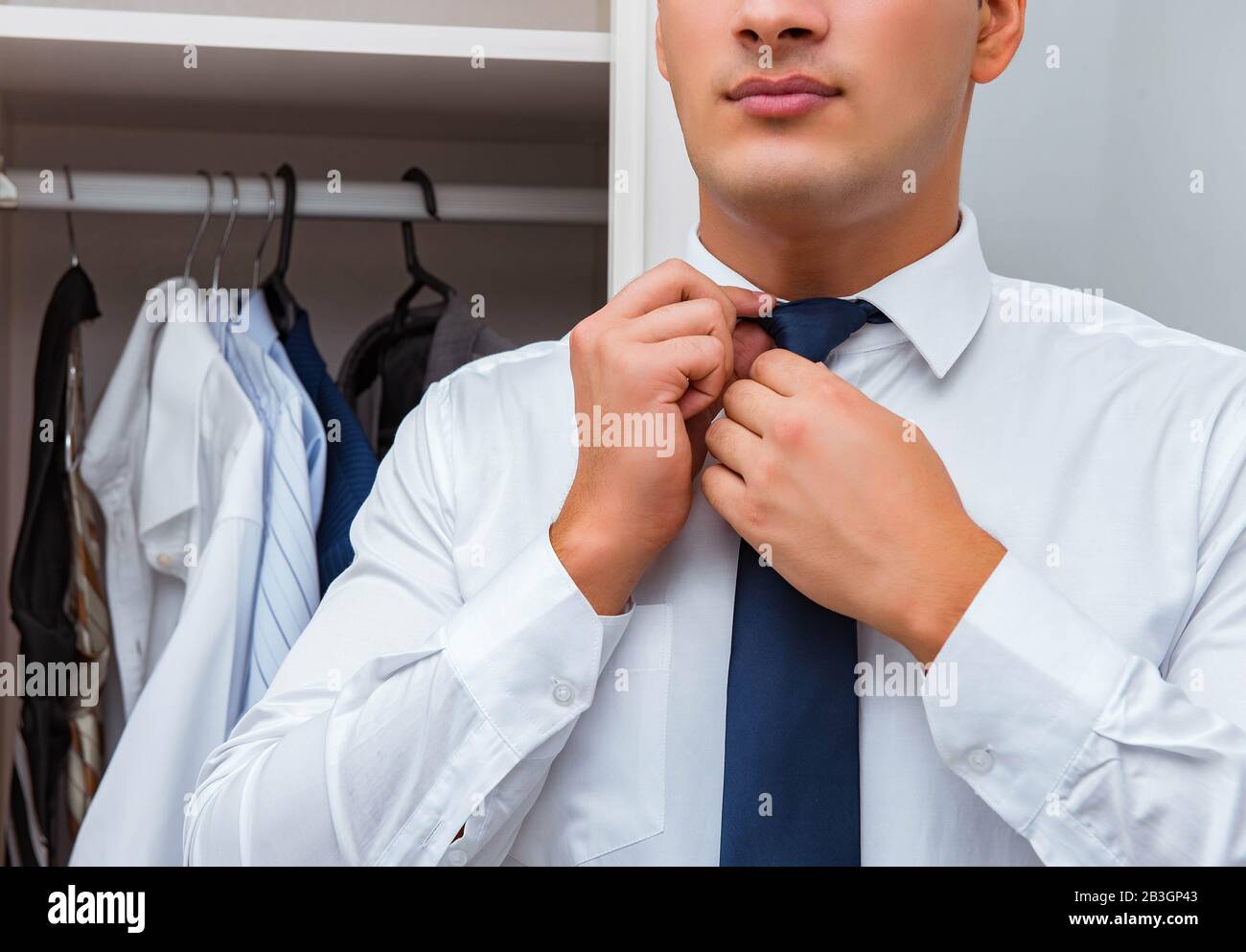 The businessman dressing up for work Stock Photo - Alamy
