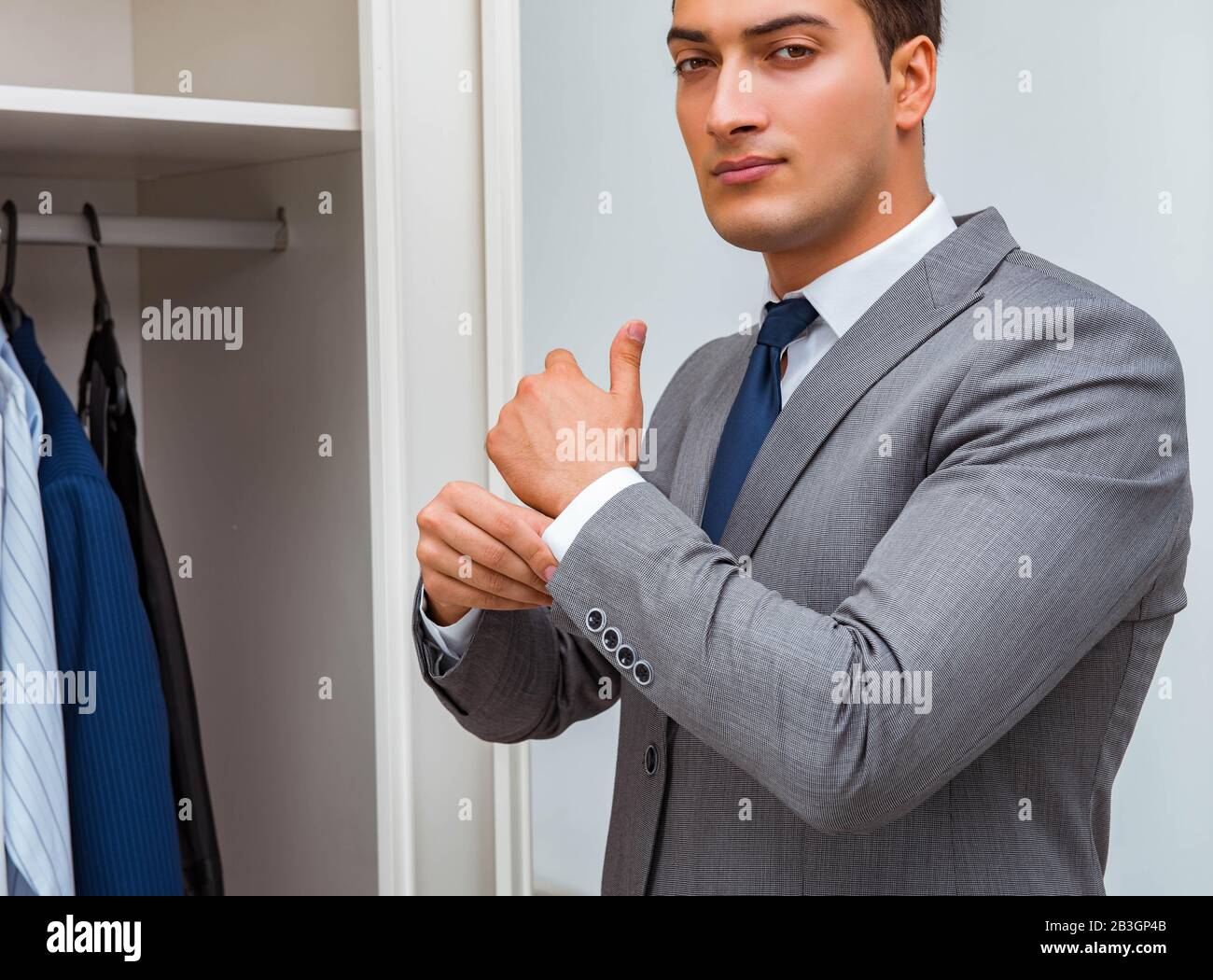 The businessman dressing up for work Stock Photo - Alamy