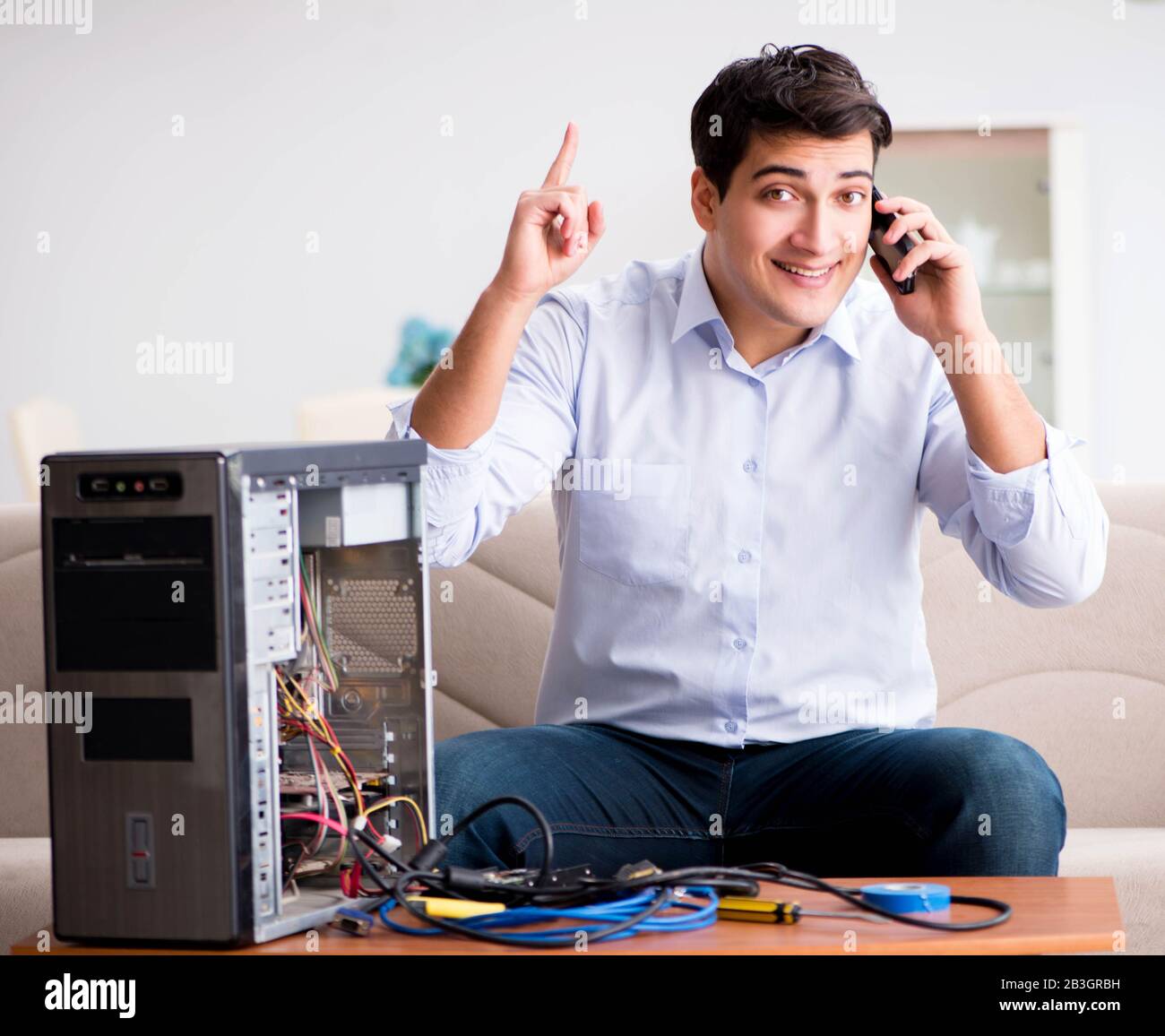 The happy customer resolving his computer problem Stock Photo - Alamy