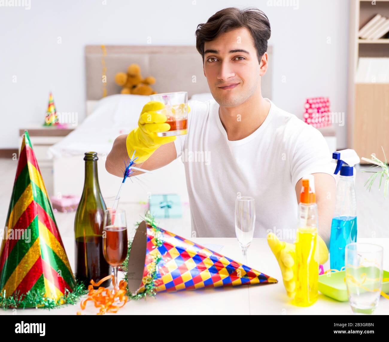 The man at home after heavy partying Stock Photo - Alamy