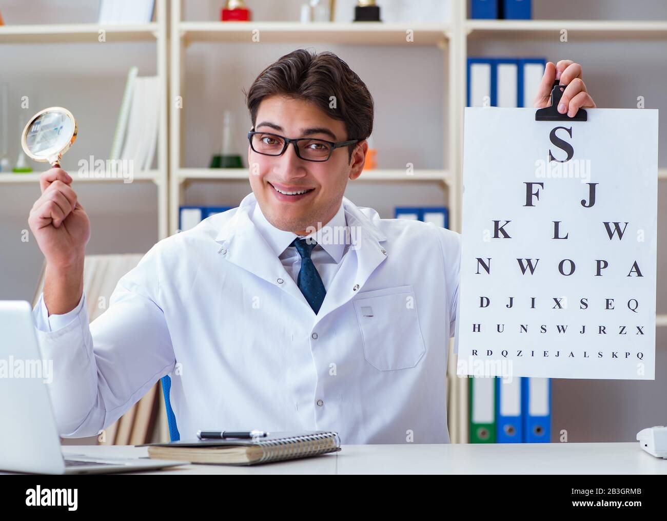 The doctor optician with letter chart conducting an eye test check ...