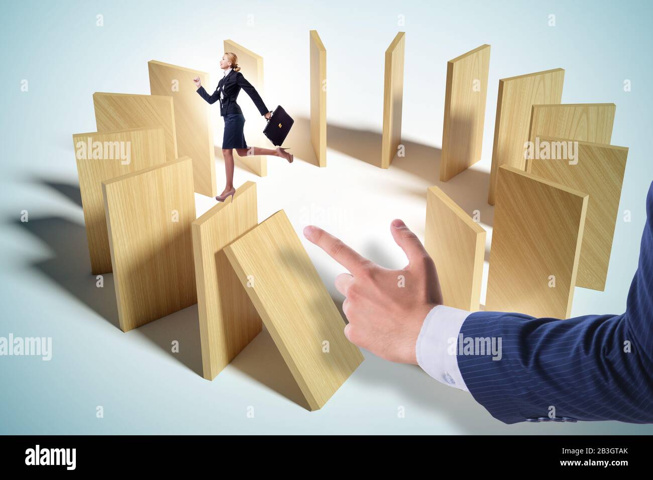 Domino effect and the competition concept Stock Photo - Alamy