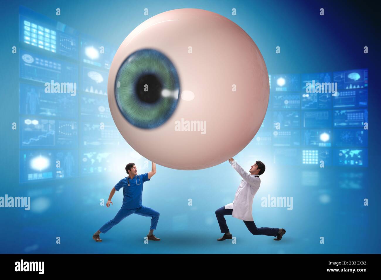 The doctor examining giant eye in medical concept Stock Photo - Alamy