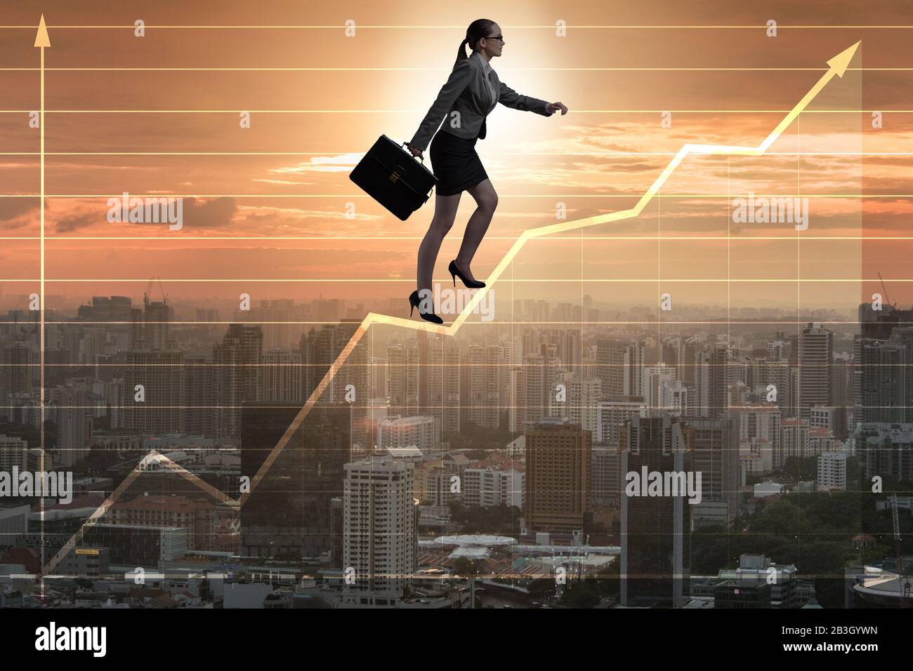 The businesswoman climbing bar charts in growth concept Stock Photo - Alamy